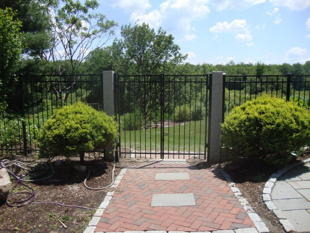 Aluminum conqueror style double gate with 8x8 granite terminal posts ...
